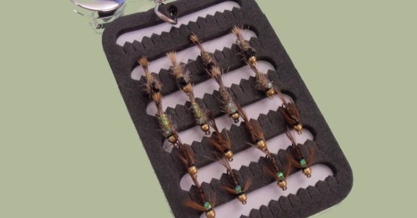 Fishing flies on a fly patch and zinger by Troutflies UK